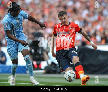 Alfie Doughty #45 of Luton Town crosses the ball during the Sky Bet ...