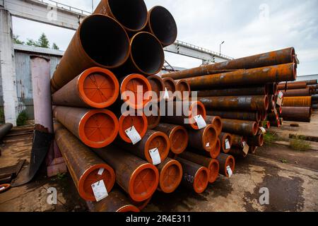 Steel tubes with red plastic caps (right) outdoor Stock Photo - Alamy