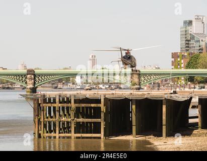 A helicopter landing at London Heliport, Lombard Road, Battersea ...