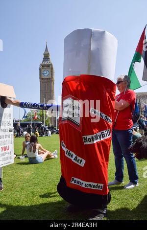 A demonstrator wears a costume during a protest Saturday, June 14, 2025 ...