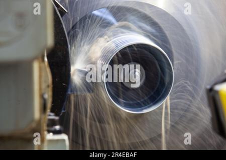 Machining pipe on turning lathe. Closeup photo. Water cooling of tool Stock Photo - Alamy