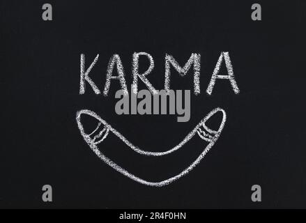 Drawn circle and word Karma written on blackboard Stock Photo - Alamy