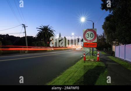 Temporary 30km speed limit sign and Detour Ahead sign by roadside ...