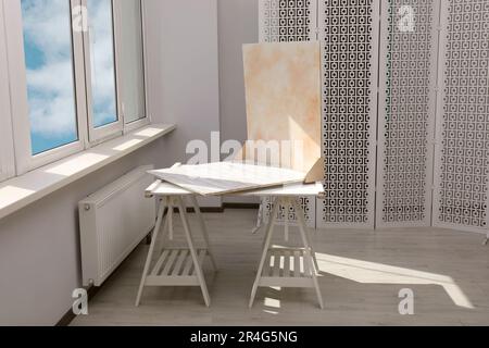 Double-sided backdrop on table in photo studio Stock Photo - Alamy