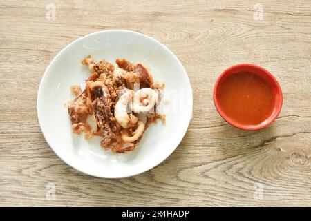 crispy fried squid stuffed flour with garlic dipping chili sauce on ...