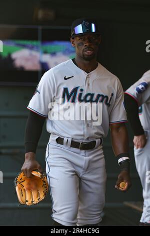 Miami Marlins center fielder Jonathan Davis leaps to catch a fly ball ...