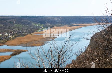 River flowing between hills and village in rural areas. Landscape Stock ...