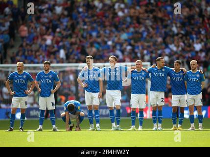 Stockport County players dejected following the Sky Bet League Two play ...