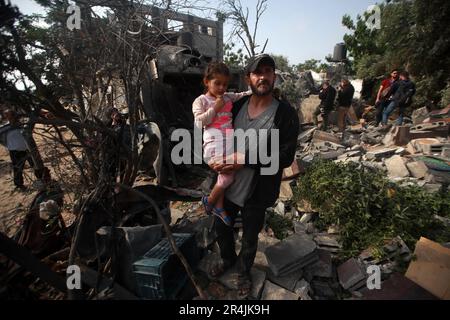 A displaced Palastinian father and child. People are homeless after Israel’s offensive left ...