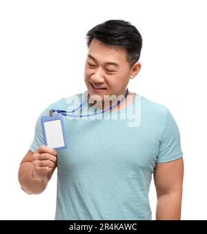 Happy asian man with vip pass badge showing thumbs up on white ...