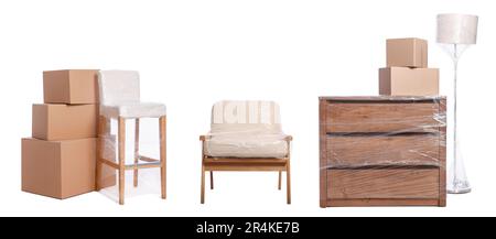 Furniture and lamp wrapped with stretch film and cardboard boxes on ...