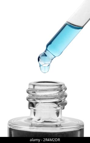 Dripping light blue facial serum from pipette on white background ...