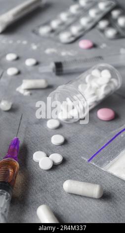 Different hard drugs on grey table, closeup Stock Photo - Alamy