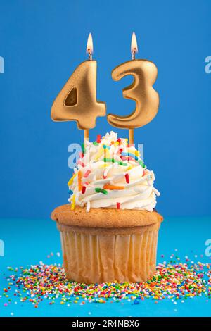 Candle number 43 - Cake birthday in orange background Stock Photo - Alamy