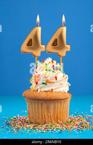 birthday cake with number 44 - cupcake on orange background with ...