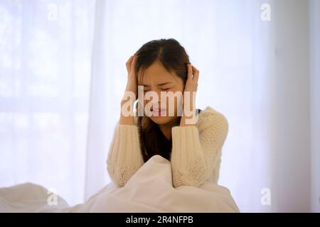 Pretty woman has emotional stress at bedroom. Emotional stress and ...