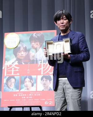 Japanese screenwriter Yuji Sakamoto (R) poses with film director ...