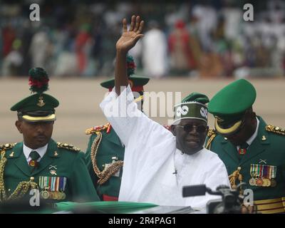 Abuja, Nigeria. 29th May, 2023. Bola Ahmed Tinubu (Front) waves to people after being sworn in ...