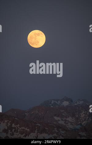 Moon rising over the Austrian Alps Stock Photo - Alamy