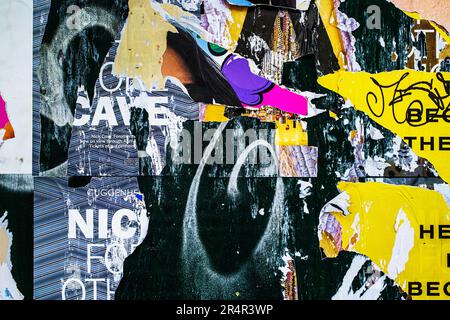 Ripped advertising posters in New York Stock Photo - Alamy