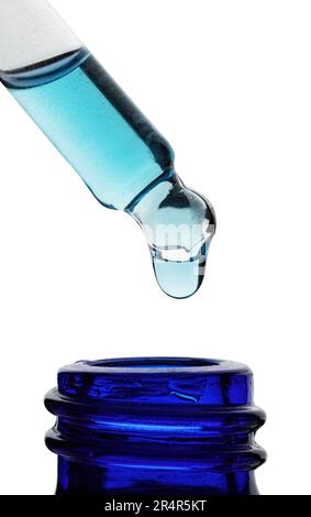 Dripping light blue facial serum from pipette on white background ...