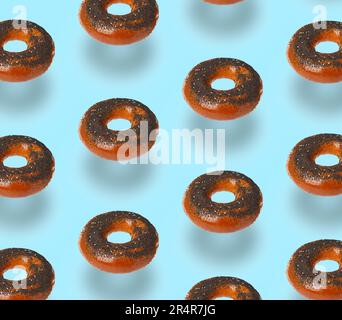 Homemade bagel roll on blue ceramic plate isolated on white background ...