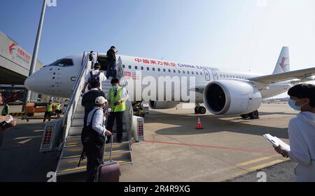 Passengers on C919 aircraft of China Eastern Airline's first regular flight are pictured on May ...