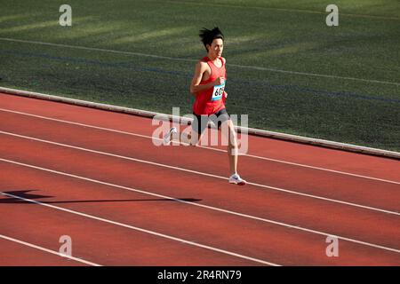 Japanese athletes running on track Stock Photo - Alamy