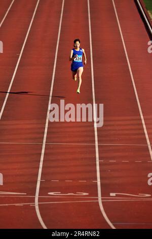 Japanese athletes running on track Stock Photo - Alamy
