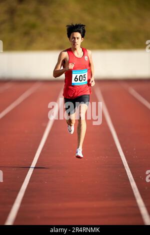 Japanese athletes running on track Stock Photo - Alamy
