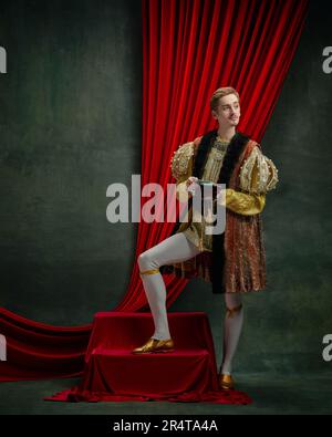 Portrait of young man, royal person in vintage clothing emotional ...