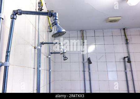 Showers at sports club Stock Photo - Alamy