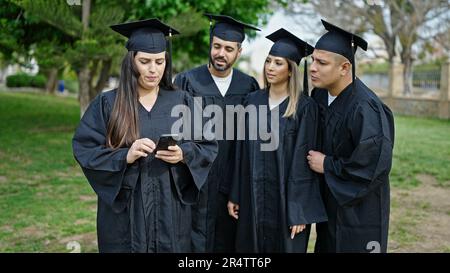 Group of people students graduated using smartphone at university ...