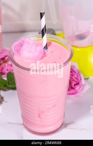 Rose flower milkshake, asian Moon milk drink. Pink matcha cocktail with ...