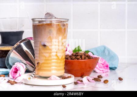 Iced Rose flower latte coffee drink, with pink rose petals taste almond ...