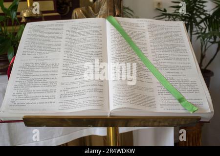 Open Bible at The Book of Psalms. Green bound bookmark over the page ...