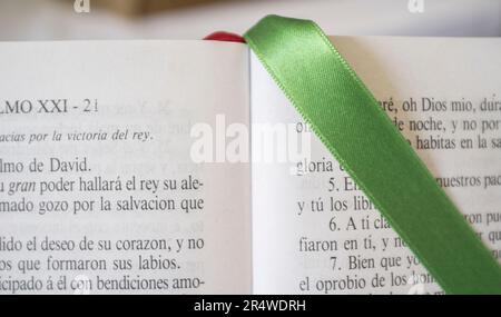 Open Bible at The Book of Psalms. Green bound bookmark over the page ...