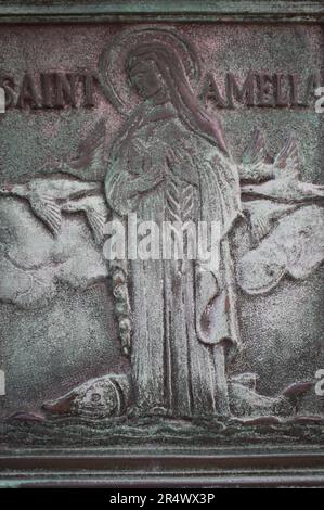 A formal portrait of Saint Amelia standing among the clouds in a black ...