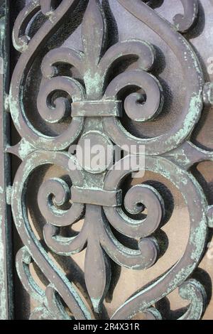 Decorative copper metal gate with lots of swirls in a black and white ...