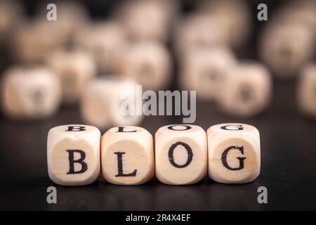 BLOGGING LIFESTYLE word written on dark paper background. BLOGGING ...