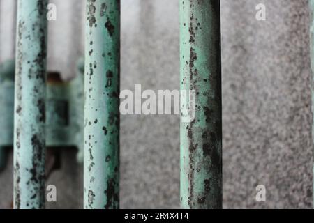 Vertical metal prison bars protecting the room inside Stock Photo - Alamy