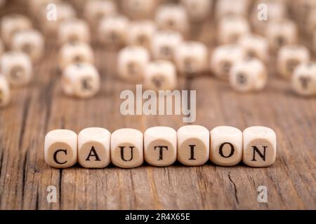 CAUTION text written on yellow-black grungy lines stamp sign Stock ...