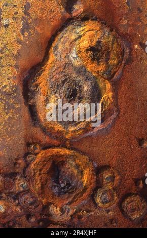 Bright vivid colours created by the rusting of the old steel plates of ...