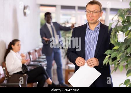 Angry hot-tempered boss shouts yells at hired employee girl in office ...