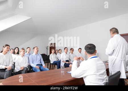Doctors giving lecture to audience on medical conference in meeting ...