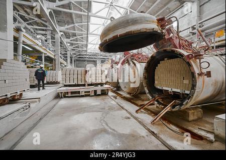 Raw bricks loaded into open autoclave for hardening in shop Stock Photo ...