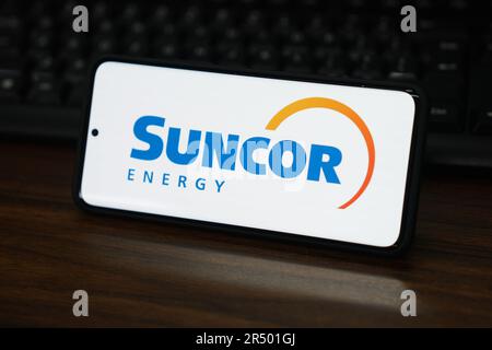 In this photo illustration, the Suncor Energy logo is displayed on a ...
