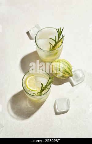 Homemade lemonade with tiger lemon ginger syrup, rosemary and ice cubes ...
