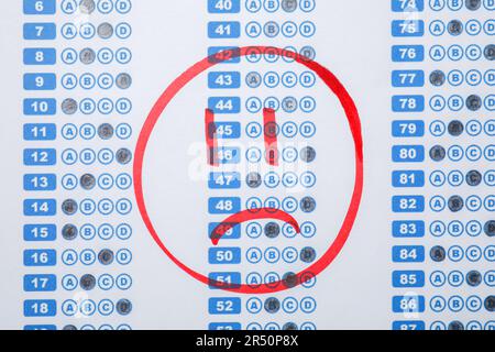 Sad face drawn on answer sheet, closeup. Student passing exam Stock ...