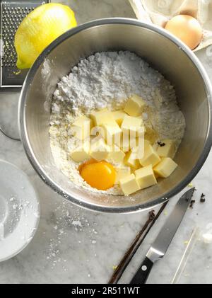 Step by step. Mixing ingredients in a mixing bowl to make zucchini ...